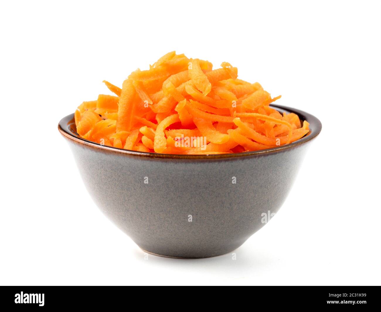 Grated carrots isolated on white Stock Photo - Alamy