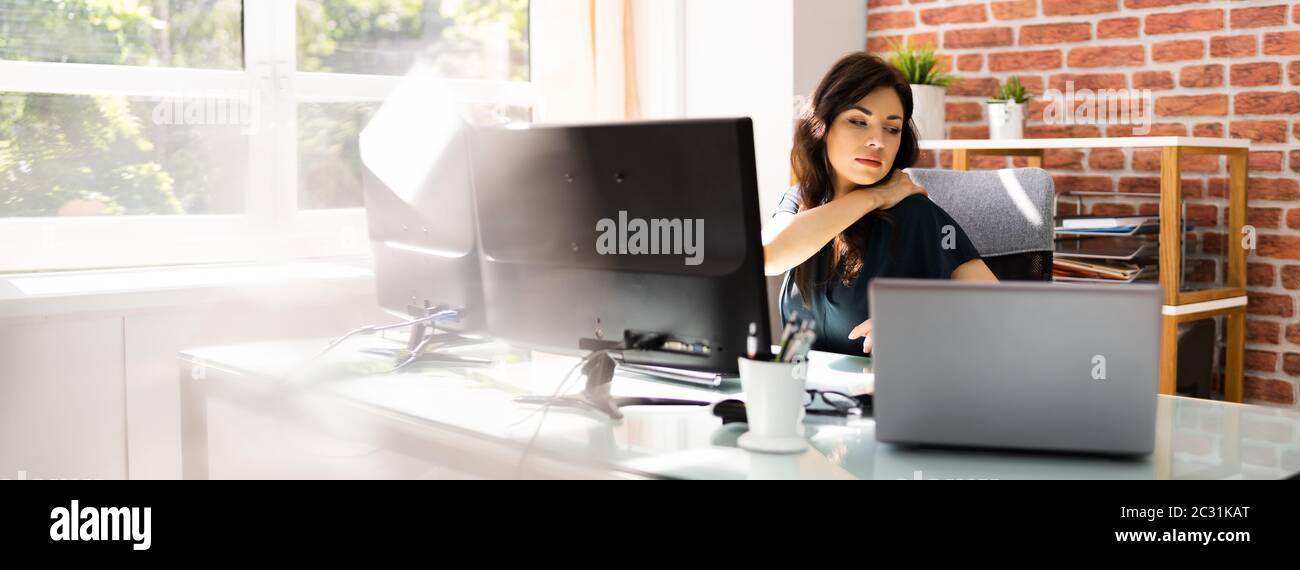 Neck Pain While Working At Computer. Bad Posture Stress Stock Photo - Alamy