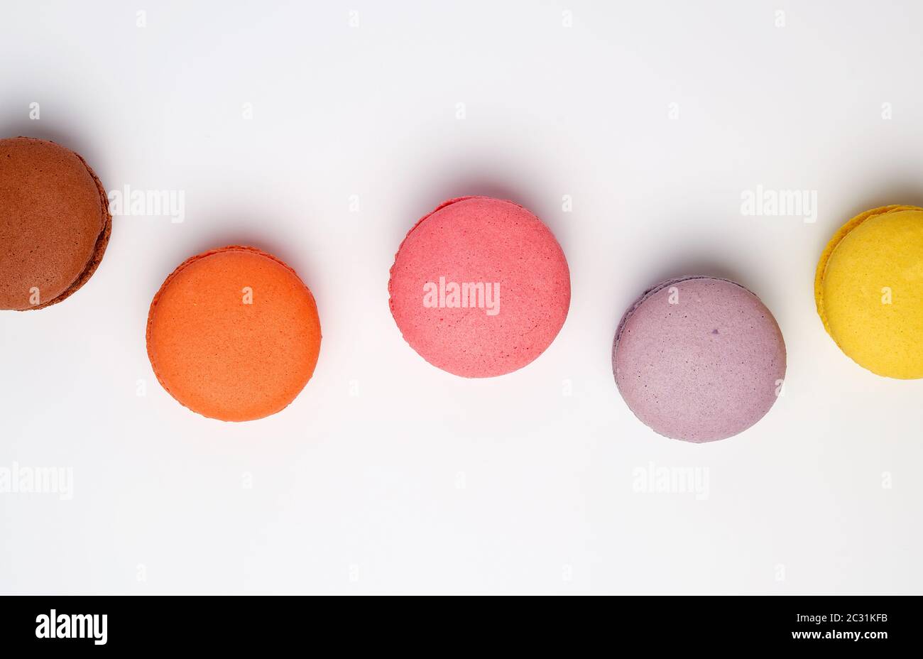colorful baked macaron almond flour on a white background, flat lay ...