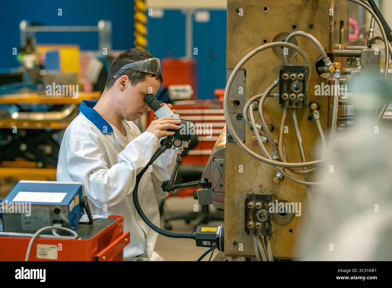 the engineer checks the correct setting of the metal mold for castings ...
