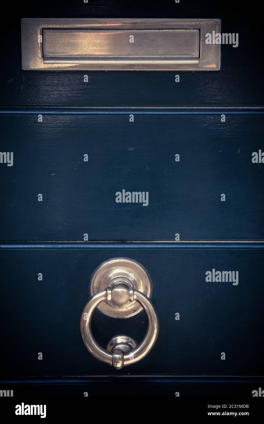 Mailbox slot and knocker on a door Stock Photo - Alamy