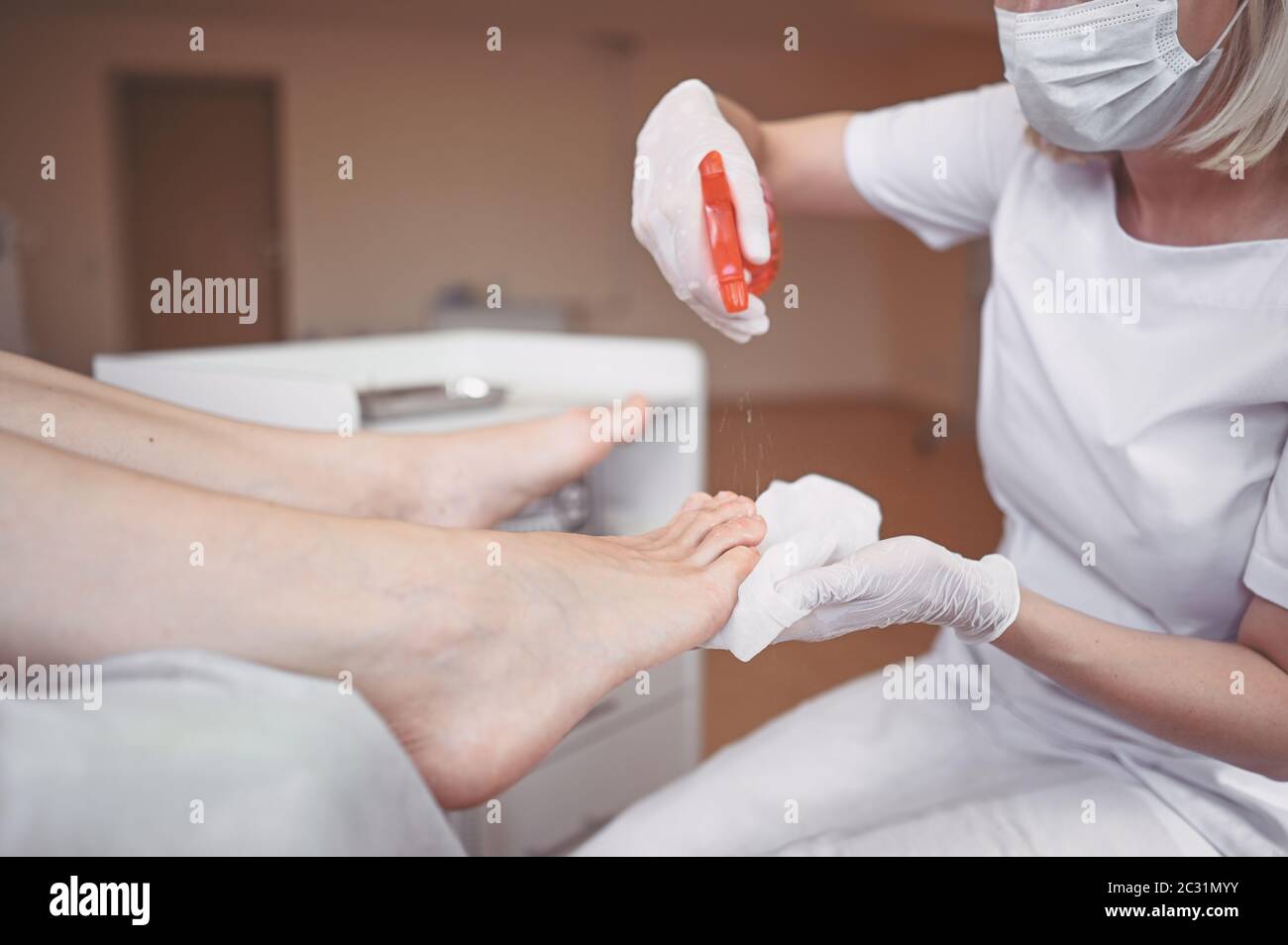 Pedicurist doing professional medical pedicure procedure in beauty ...