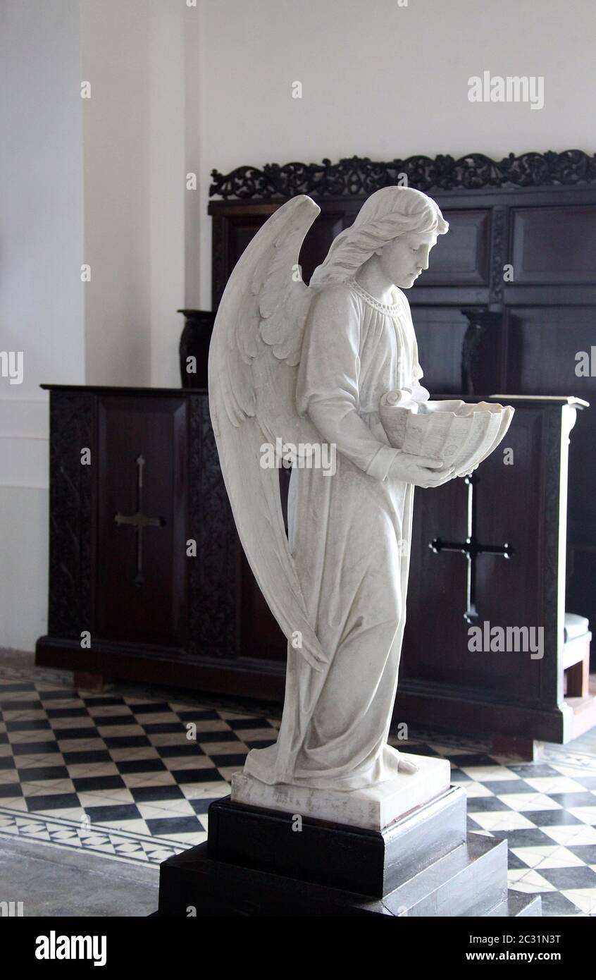 Angel stoup at the inside entrance of the Catholic Church of the ...