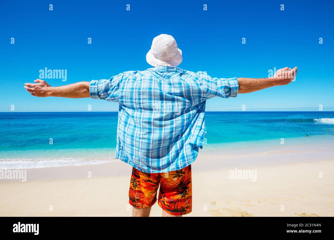 Man on the beach Stock Photo - Alamy