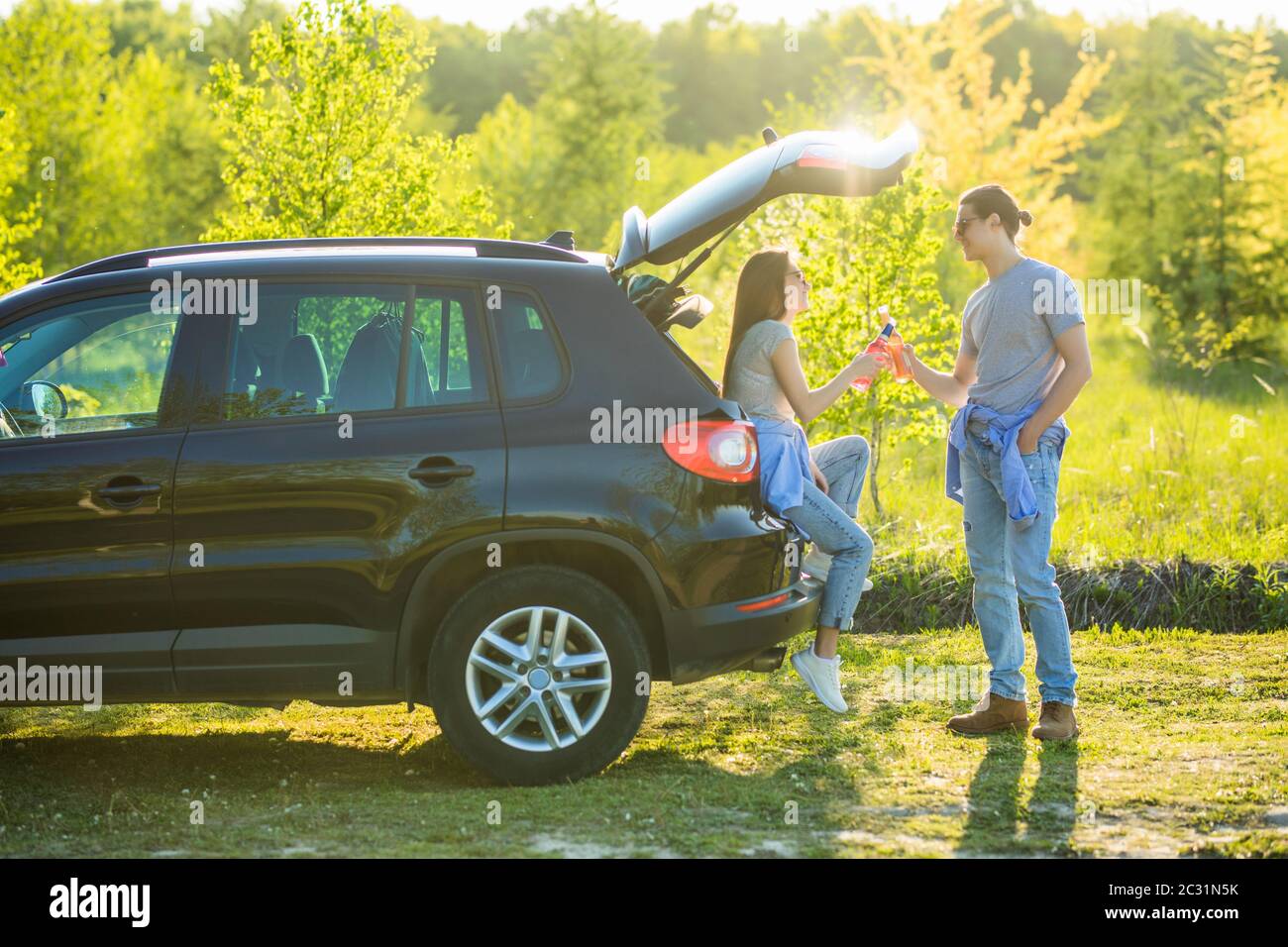 Silhouette woman sitting on car hi-res stock photography and images - Alamy