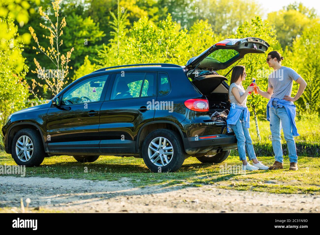 Beautiful young of a couple having romantic time drinking drinks in the ...