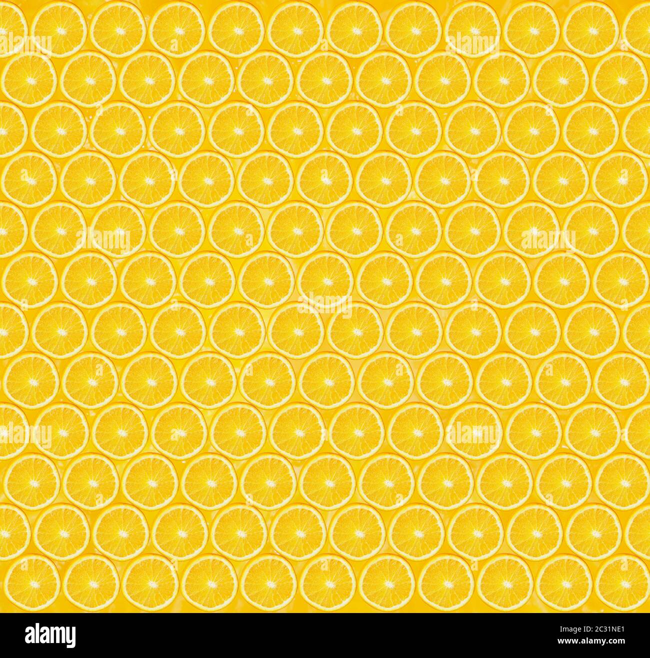 Texture of sliced orange slices on yellow background. Cut pieces of ...