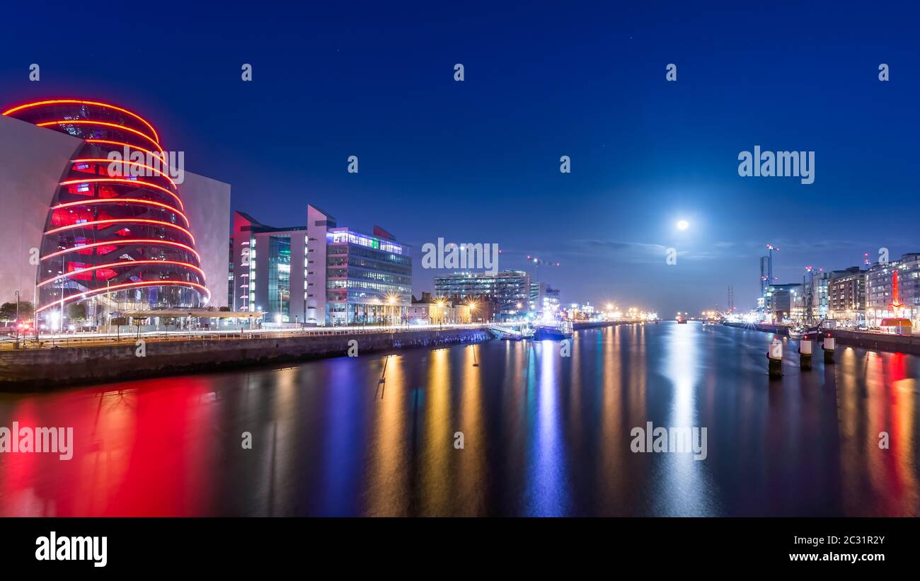 Blue hour at Dublin docks. Beautifully illuminated embankment and ...