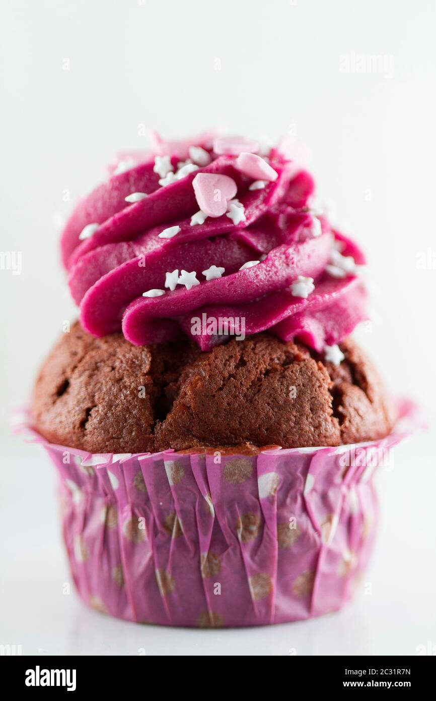Close up on baked cupcakes isolated on white Stock Photo - Alamy