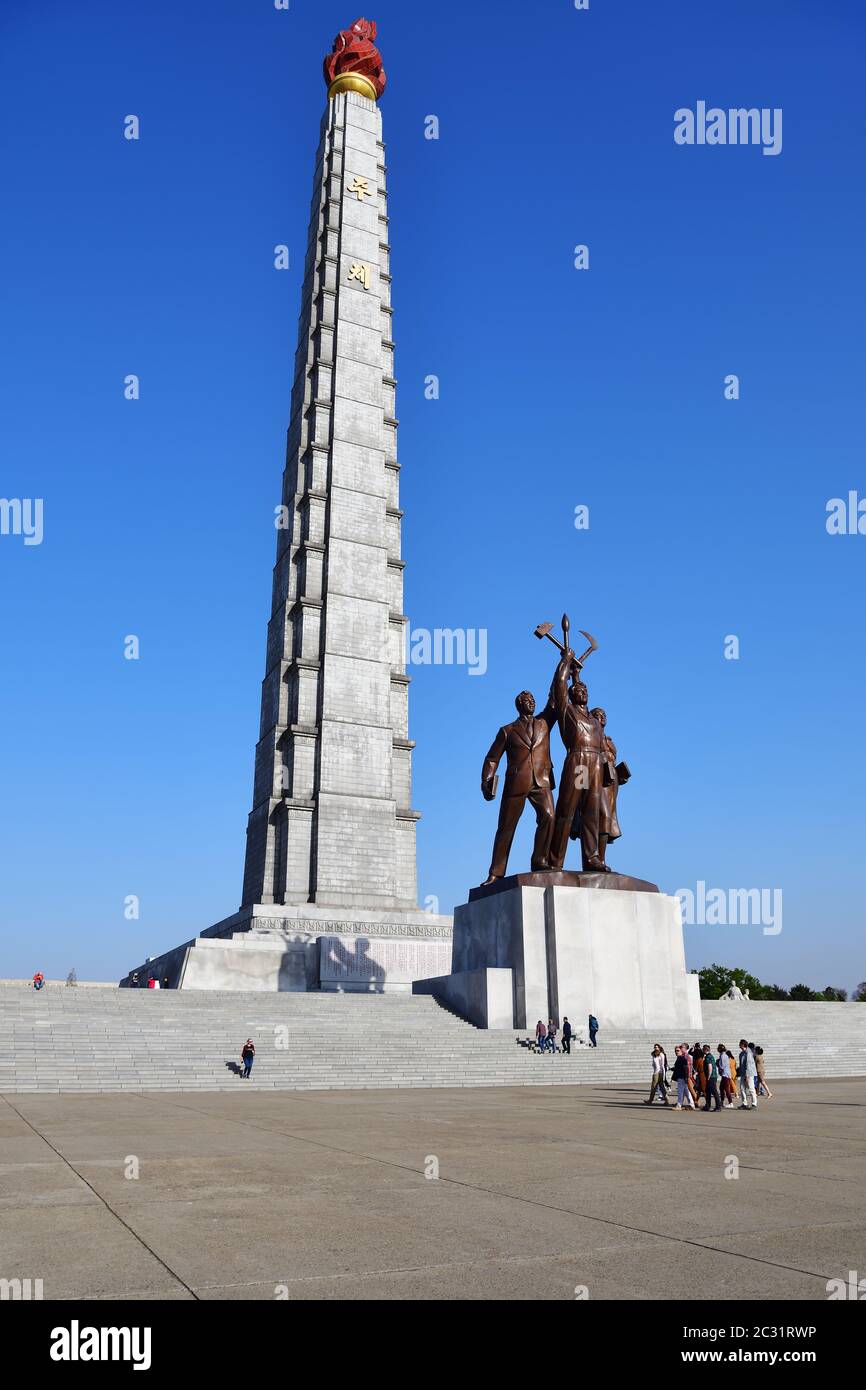 Pyongyang, North Korea - May 1, 2019: Tourists nearby Tower of the ...