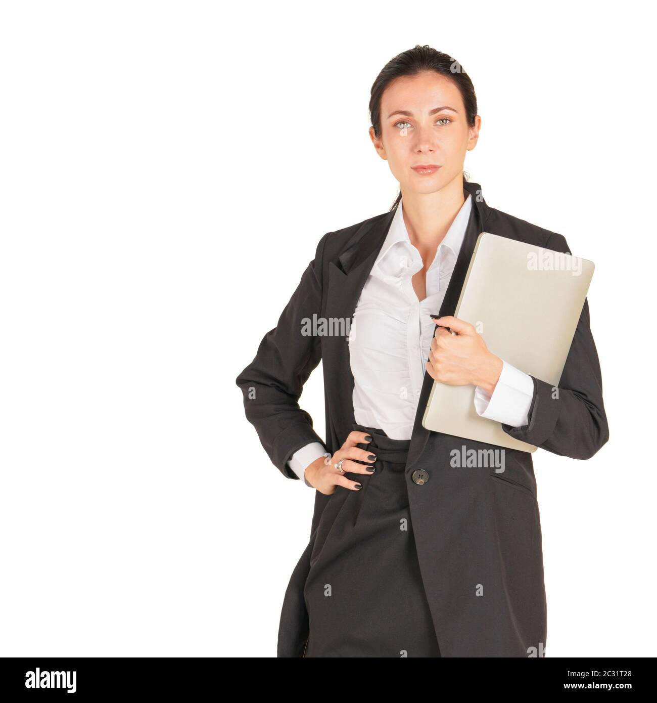 A business woman in a black suit holding on a computer notebook ...