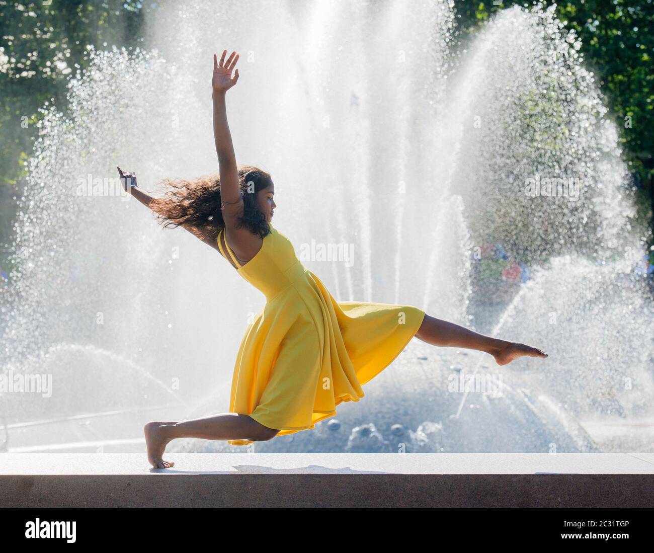 Young woman dancing fountain hi-res stock photography and images - Alamy