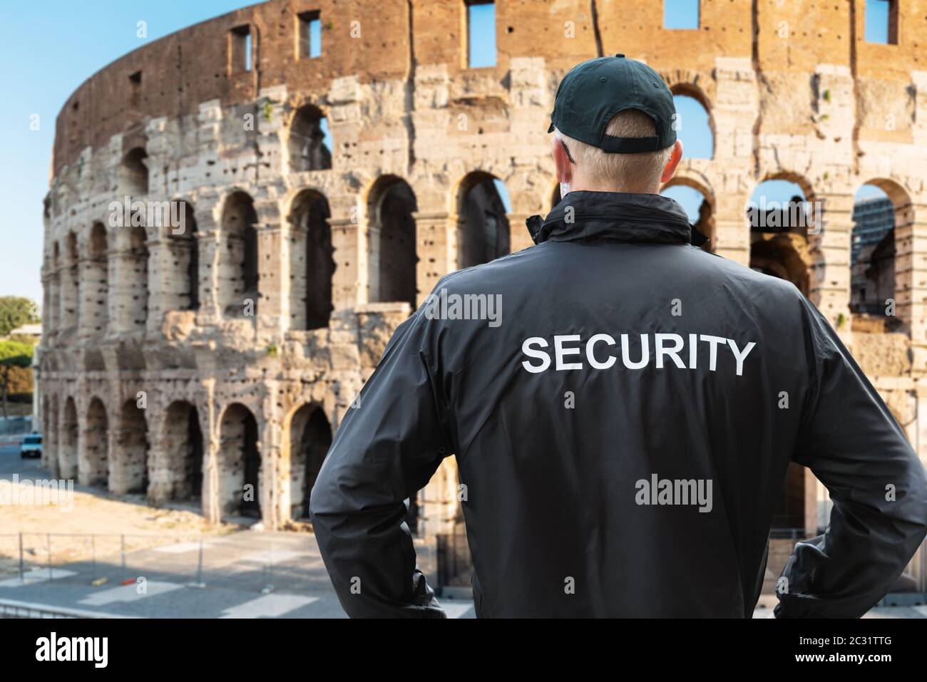 Man In Security Uniform Standing Near Coliseum In Rome, Italy Stock ...