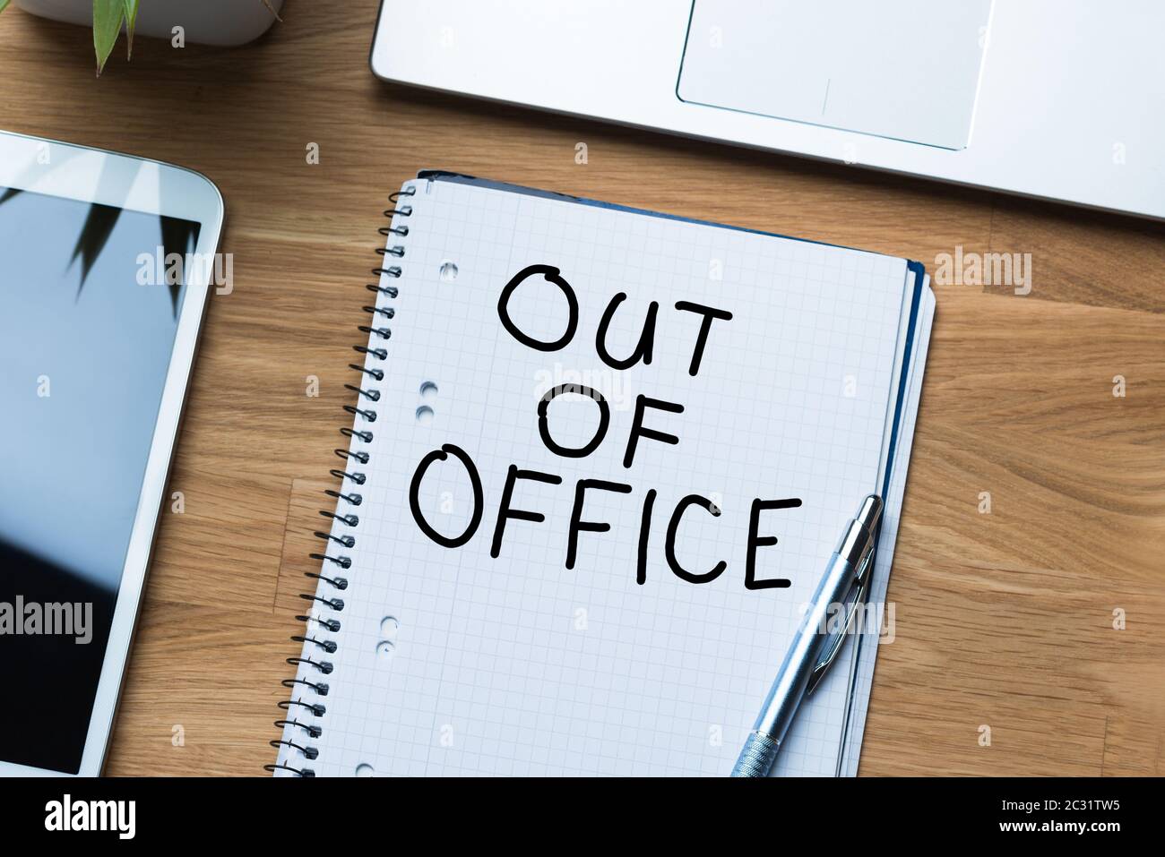 Out Of Office Message On Notepad With Pen Near Laptop And Digital ...