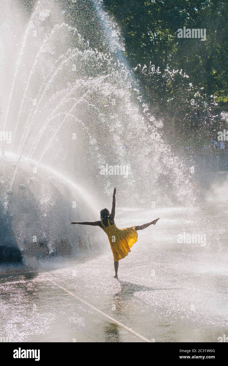Young woman dancing fountain hi-res stock photography and images - Alamy