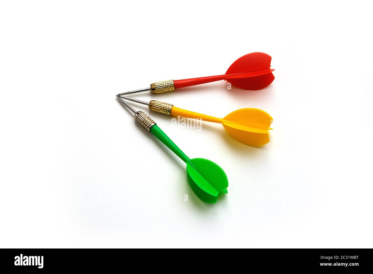red, green and yellow colored dart arrow, on white ground Stock Photo ...