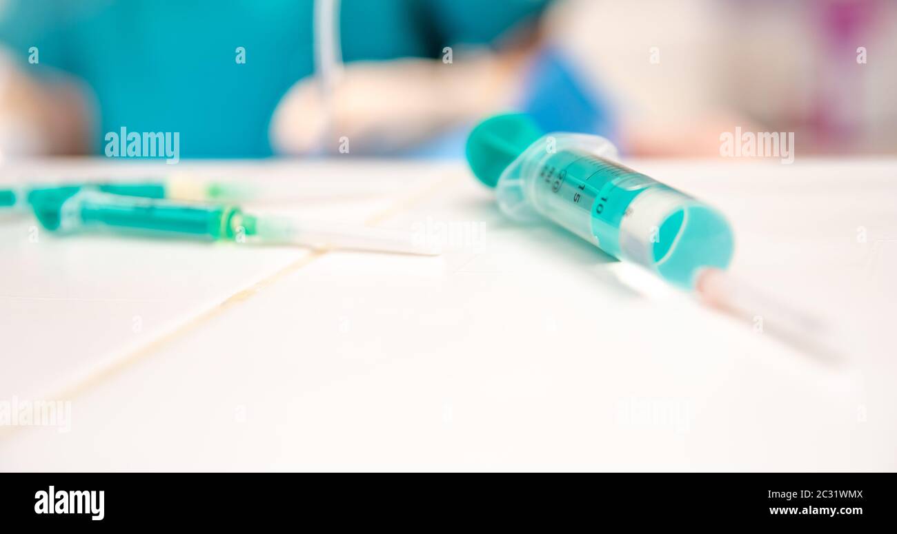 syringes ready for vaccination in hospital. administering drug to veins ...