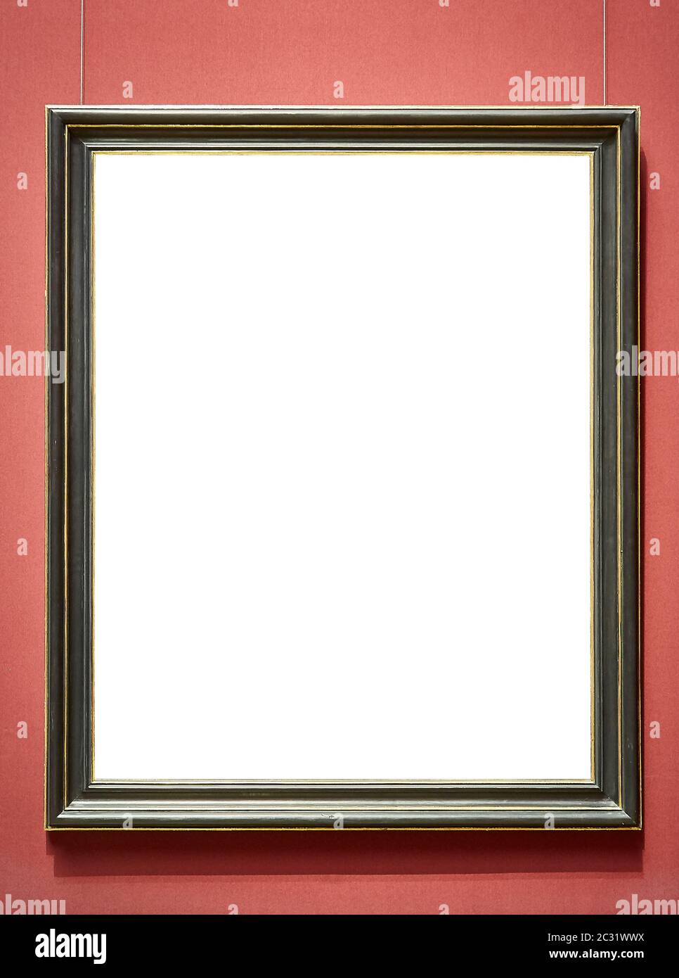 Empty picture frame on red colored wall Stock Photo - Alamy