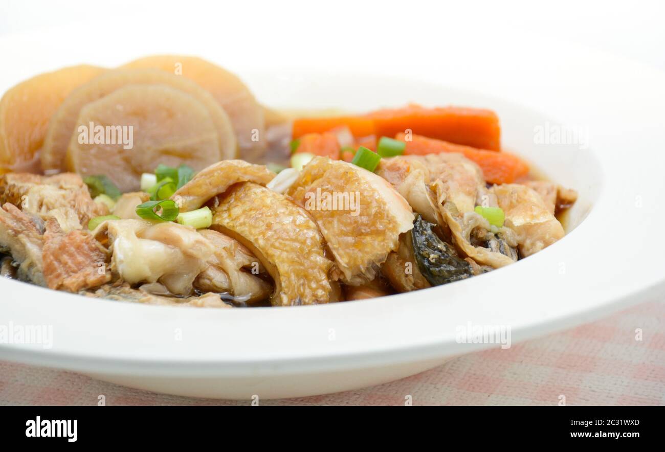 Salmon in soy source with vegetables, fish maw soup Stock Photo - Alamy
