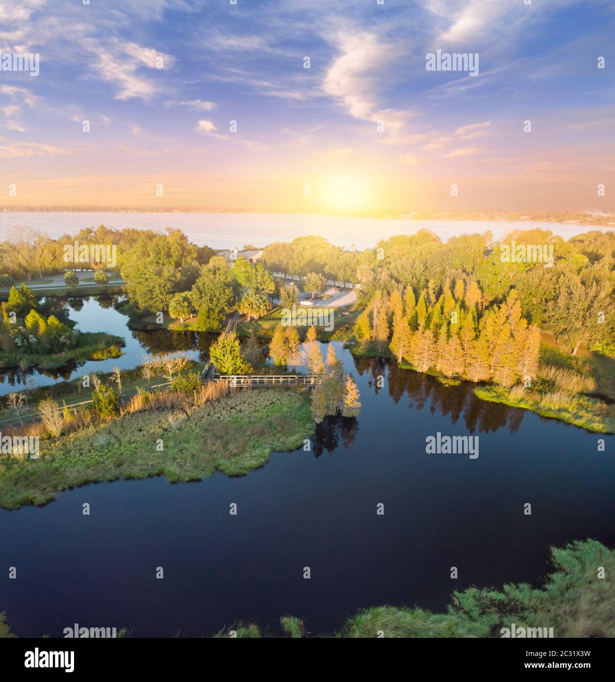 Small Park in Florida wetlands at sunset. Aerial view Stock Photo - Alamy