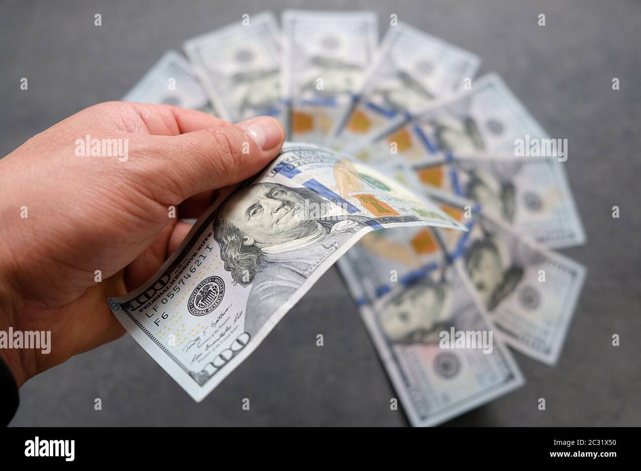 $100 dollars too much standing on a black background, world currency ...