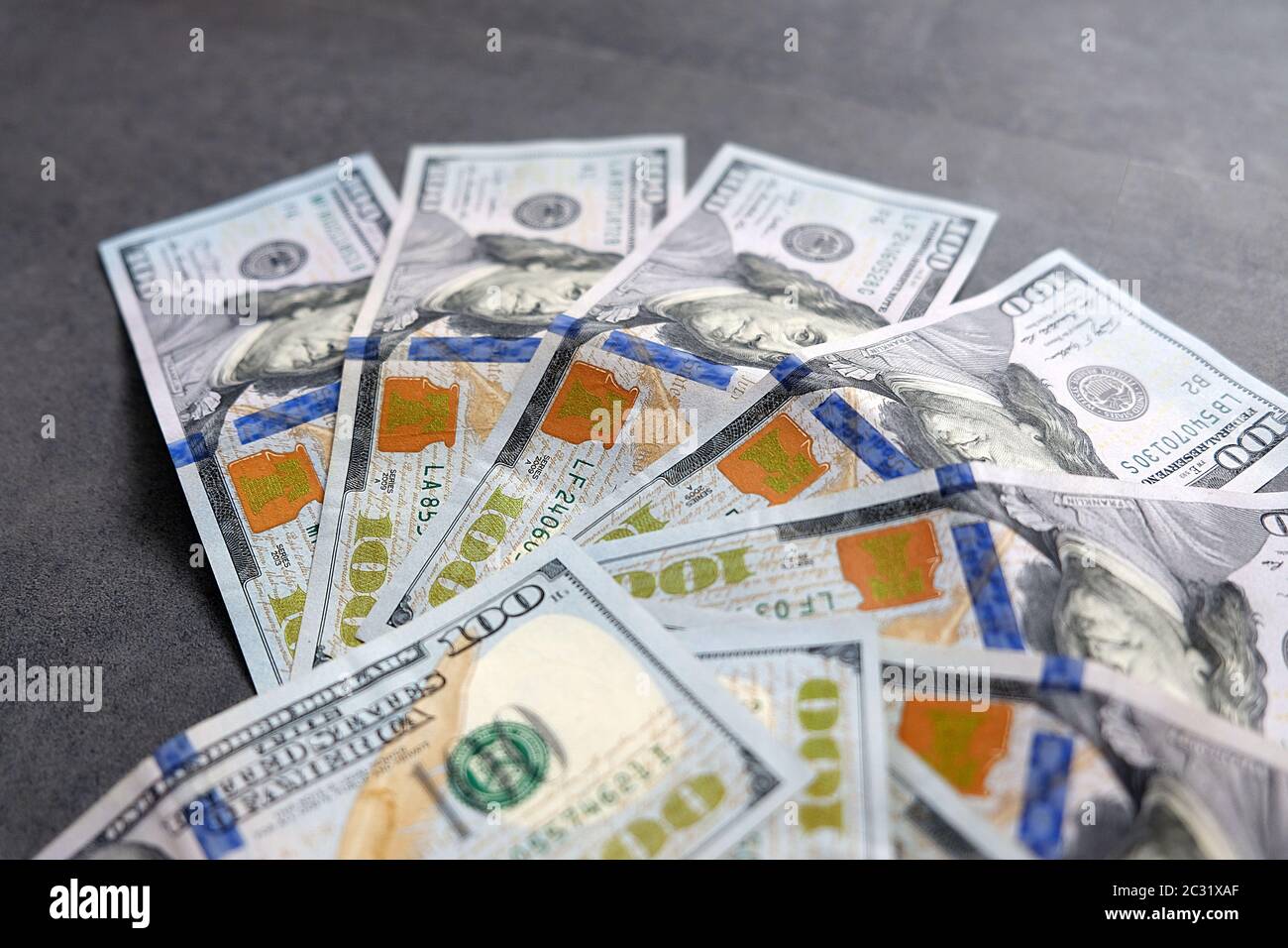 $100 dollars too much standing on a black background, world currency ...