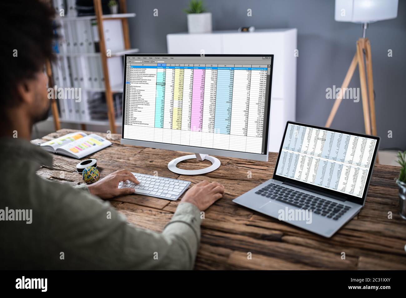 Young man working on spreadsheet hi-res stock photography and images ...