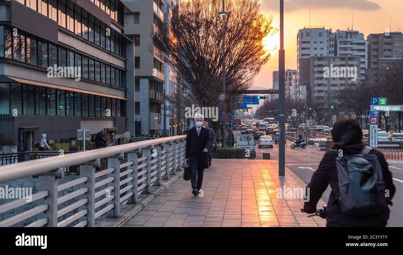 People in the street of Kyoto at sunset, Japan Stock Photo - Alamy