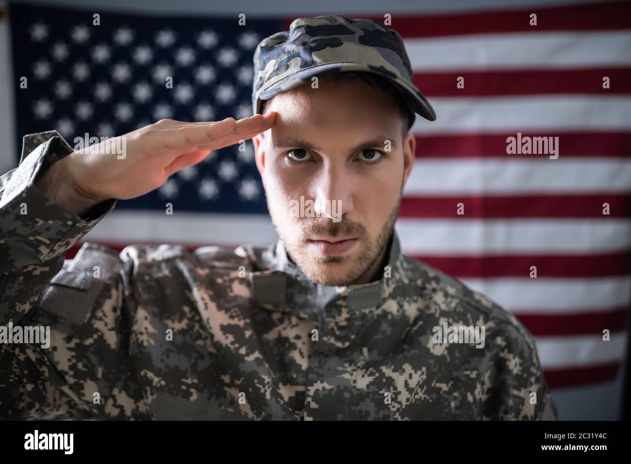 American flag man saluting hi-res stock photography and images - Alamy