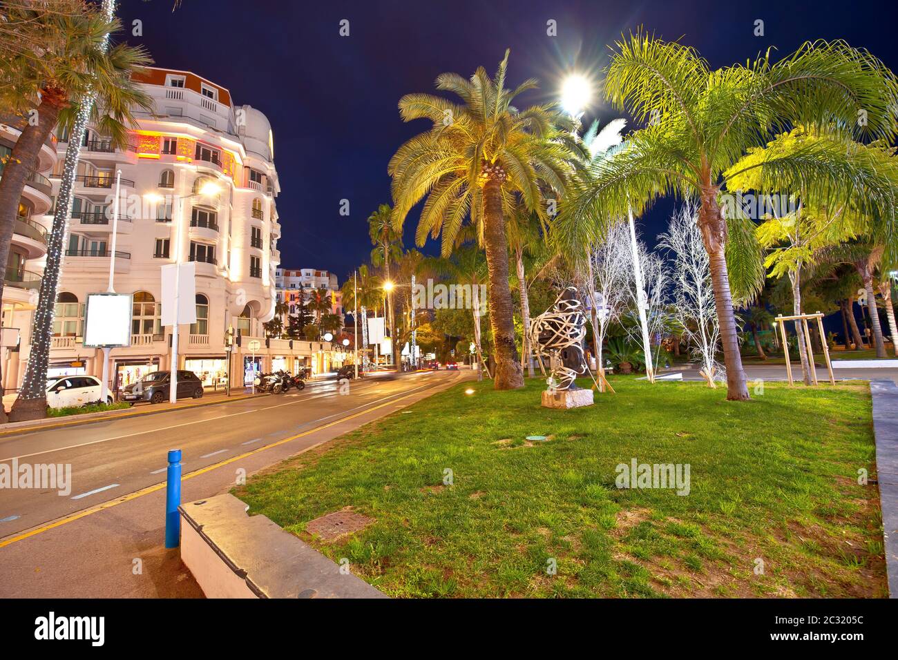 Cannes. Palm waterfront architectue in town of Cannes evening view ...