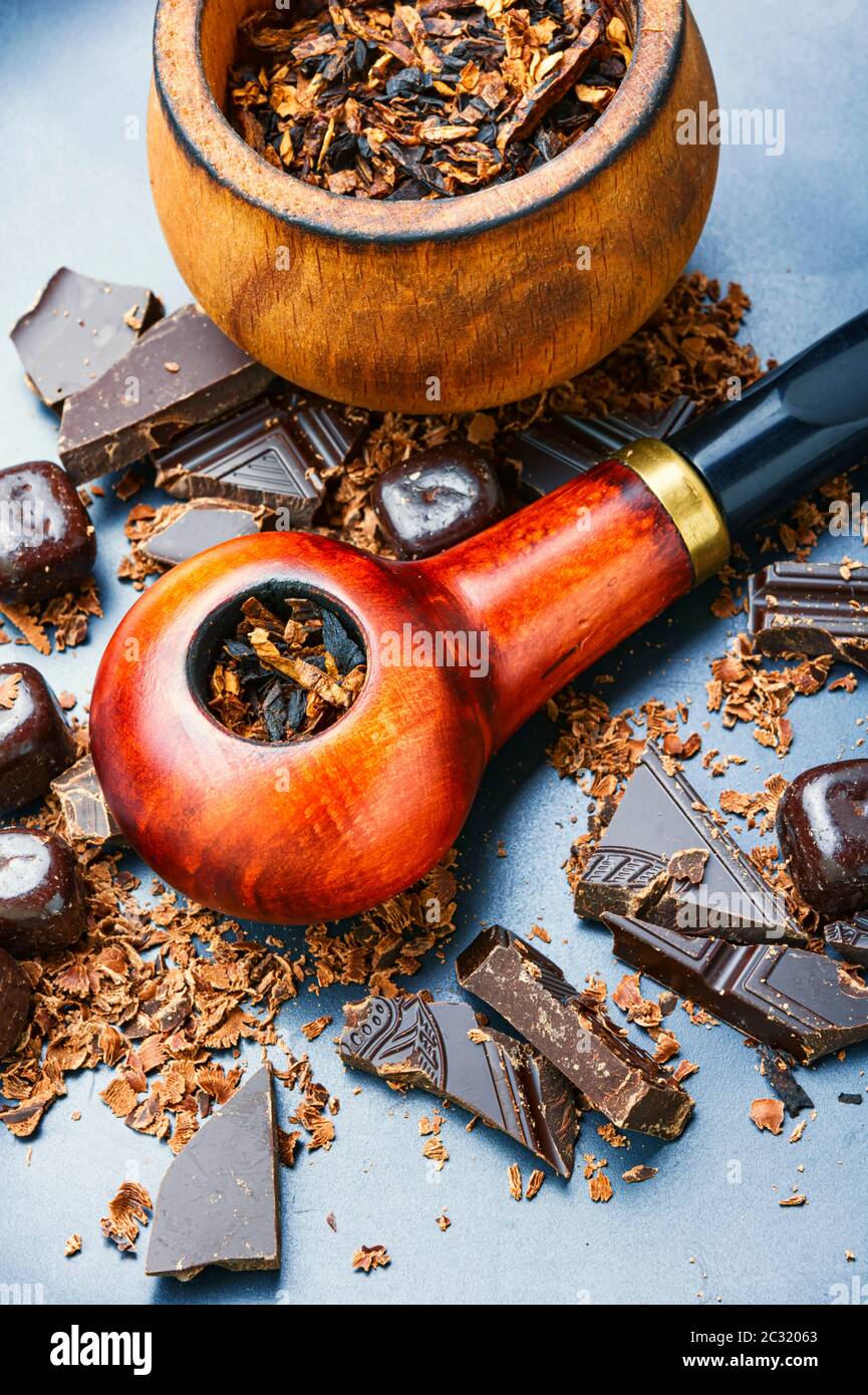Chocolate flavored tobacco for smoking pipes.Tobacco pipe filled with ...