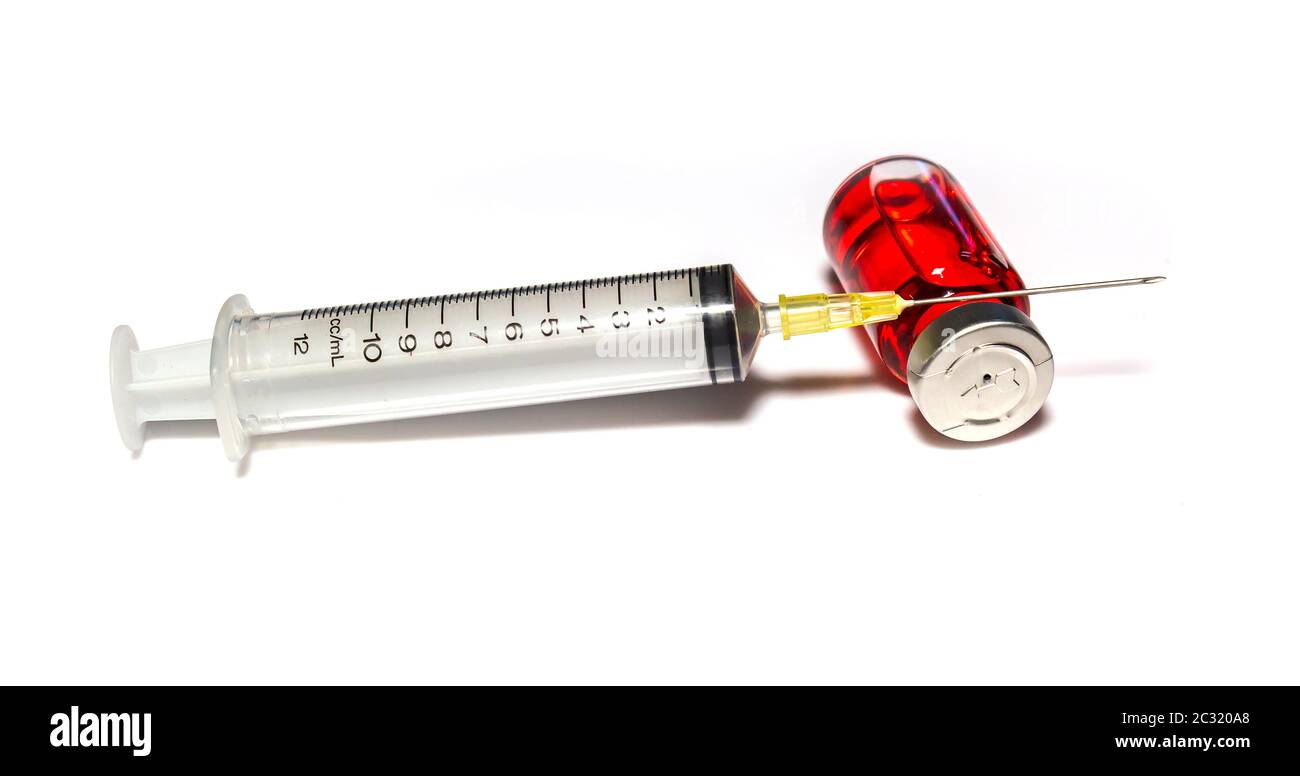 Needle and injection with red water bottle on white background Stock ...
