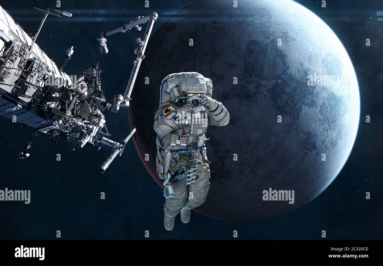 Astronaut, ISS in orbit of the moon. Solar system Stock Photo - Alamy