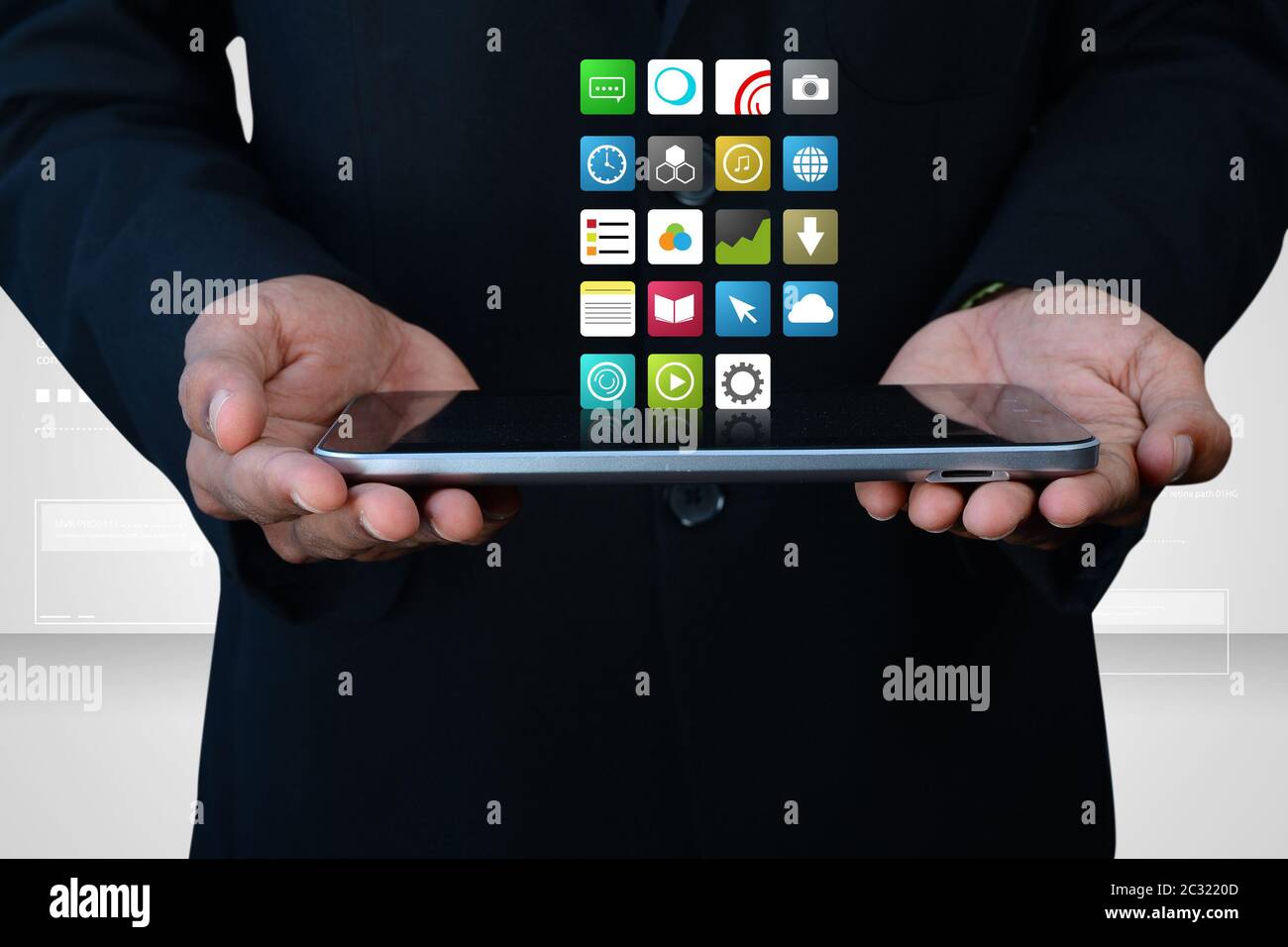 Man showing the app icons in digital tablet Stock Photo - Alamy