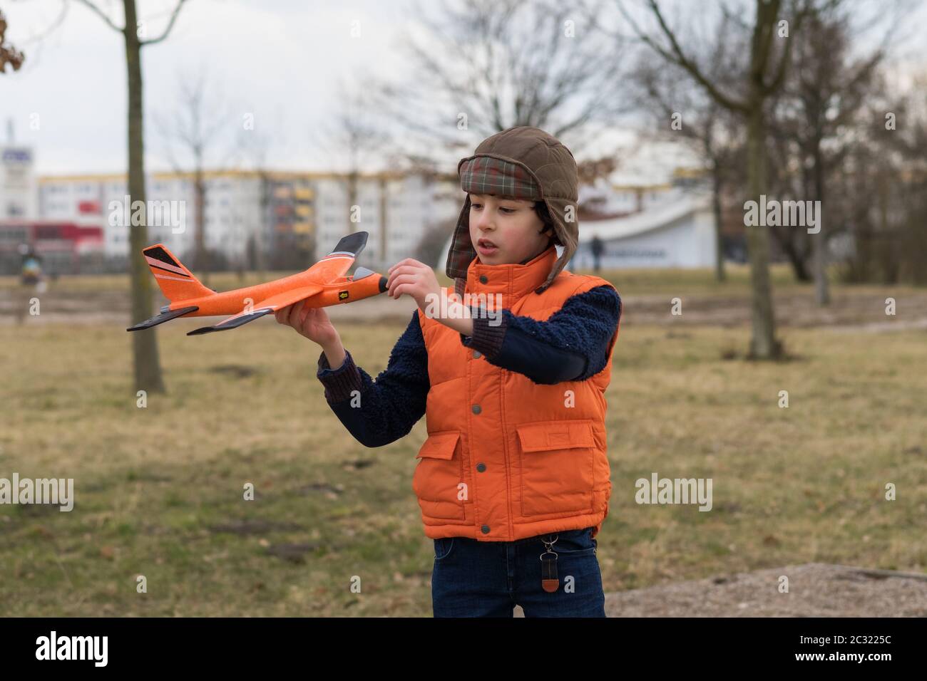 Boy playing in nature with a model of a glider (airplane Stock Photo ...