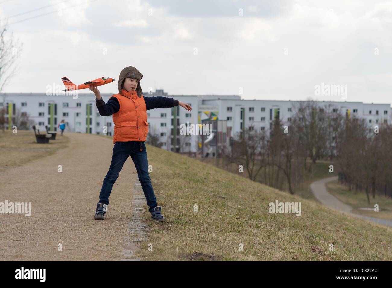 Boy playing in nature with a model of a glider (airplane Stock Photo ...