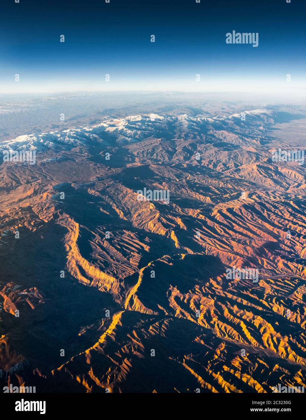 Aerial View from an Airplane. Flying above Beautiful Land at Sunrise ...