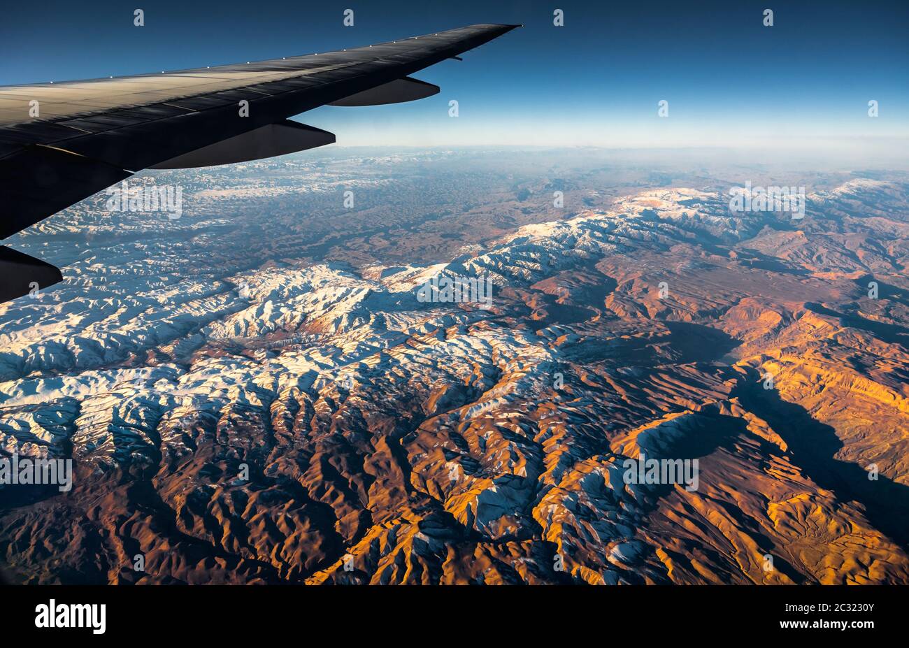 Aerial View from an Airplane. Flying above Beautiful Land at Sunrise ...