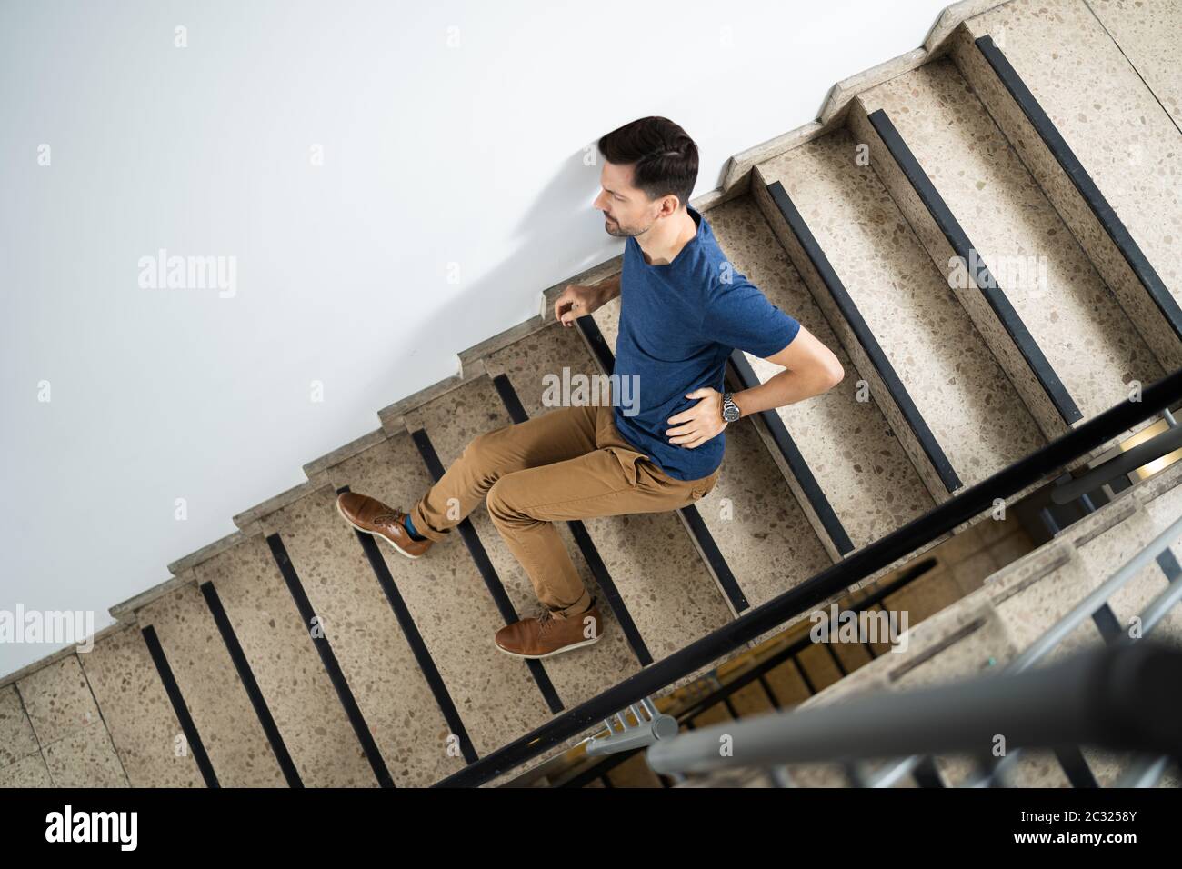 Man Lying On Staircase After Slip And Fall Accident Stock Photo - Alamy