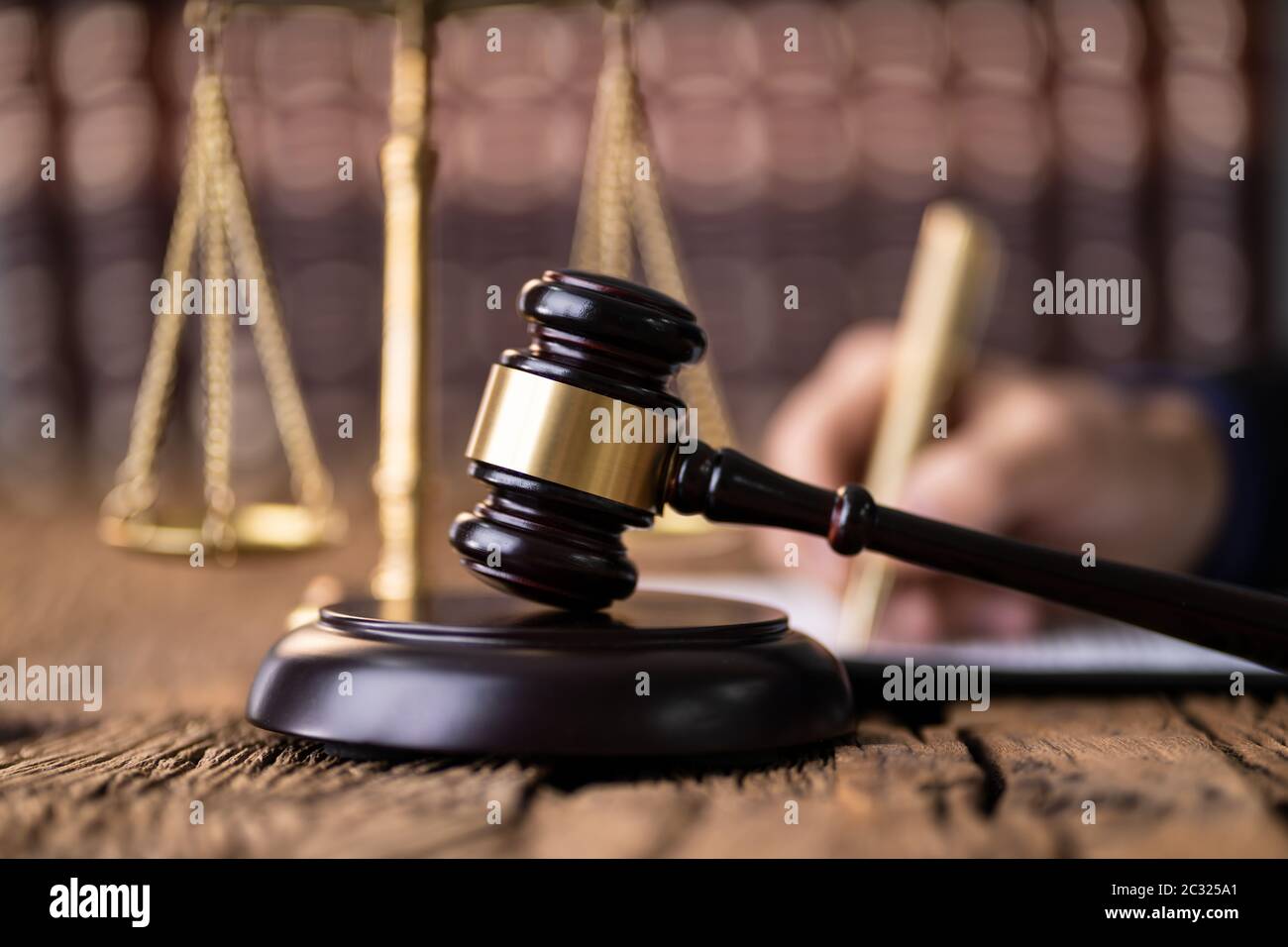Judge Writing On Legal Documents At Desk Stock Photo - Alamy