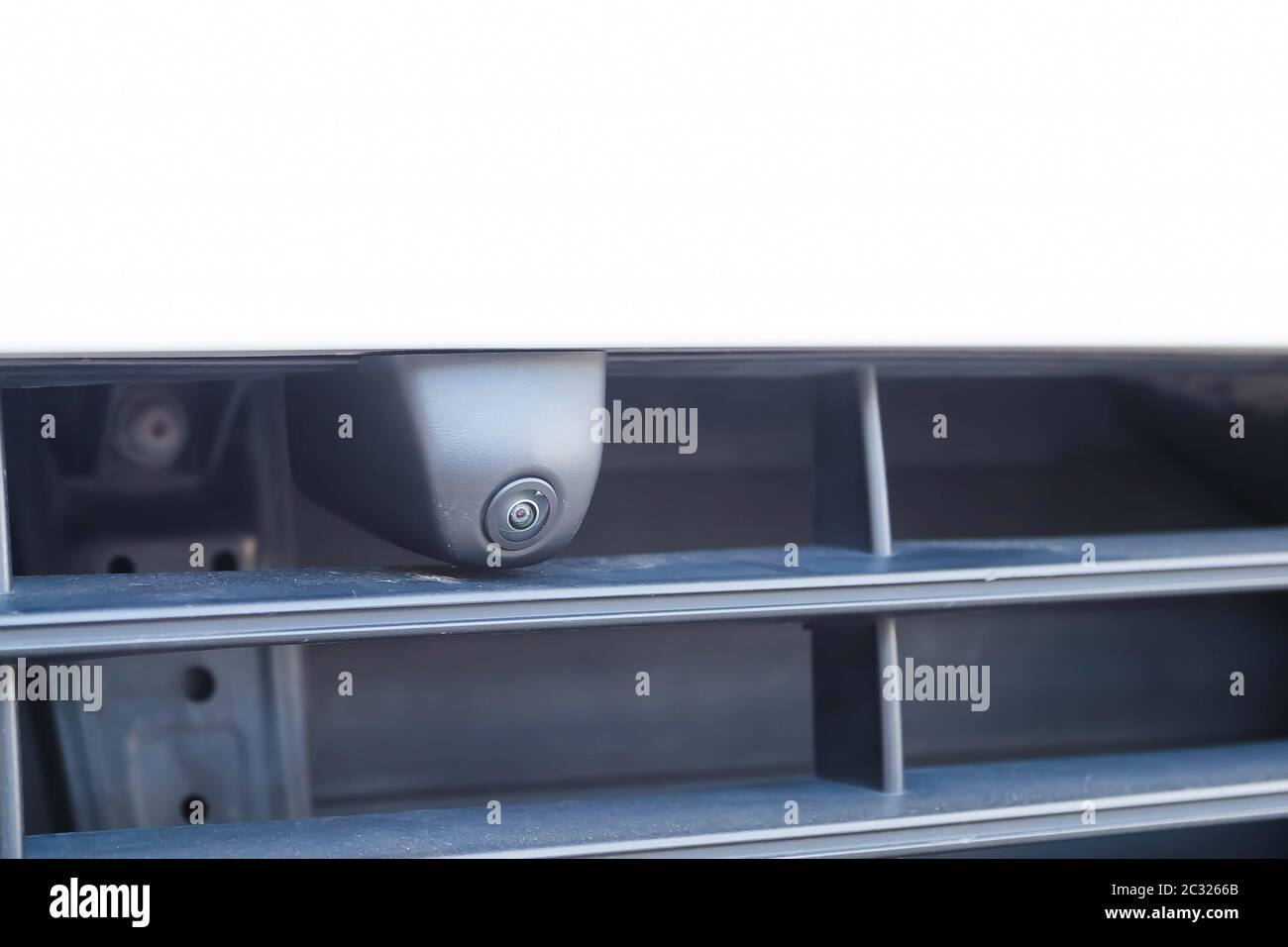 Closeup. Front view camera in the front bumper of the car. Circular 360 ...