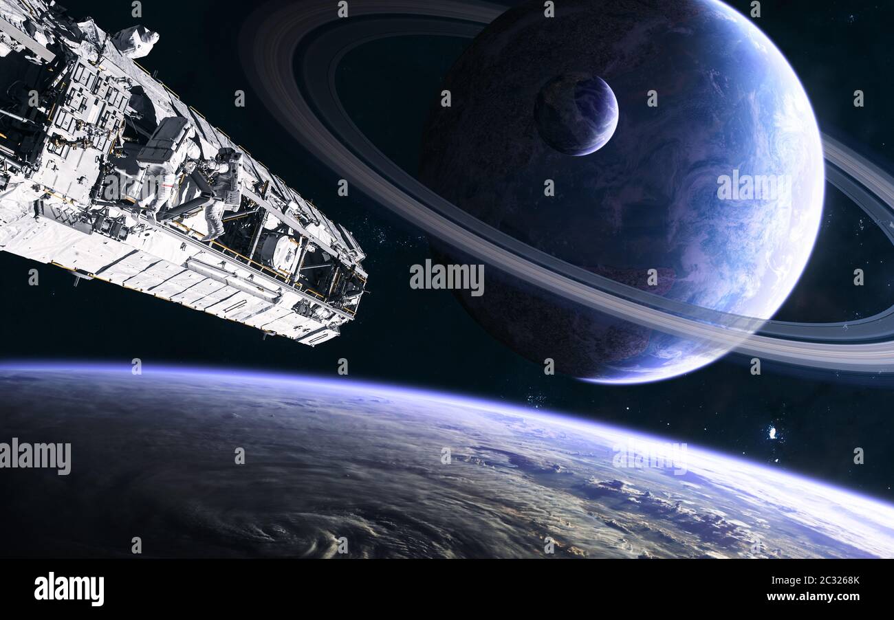 Planet with rings and satellites. Space station in orbit of deep space ...