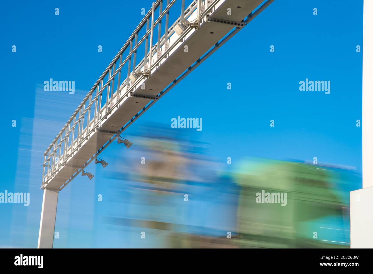 truck drive through the highway through the toll gate, toll charges ...