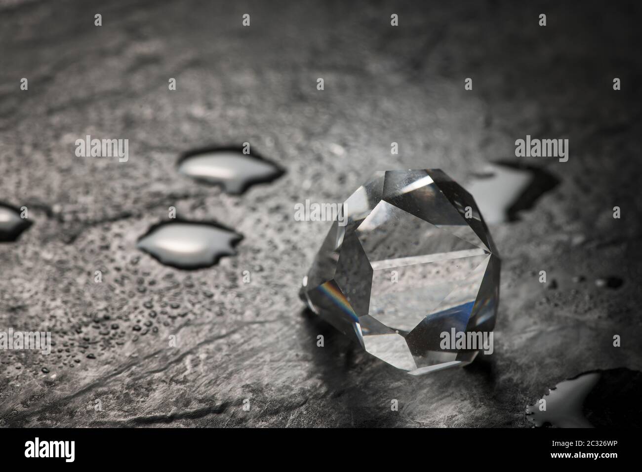 Cut crystal on slate with color reflection Stock Photo - Alamy