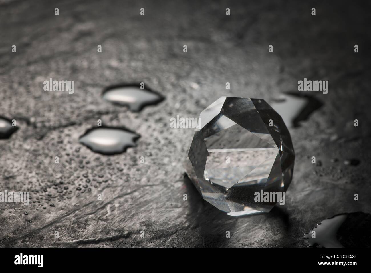 Cut crystal on slate with drops Stock Photo - Alamy