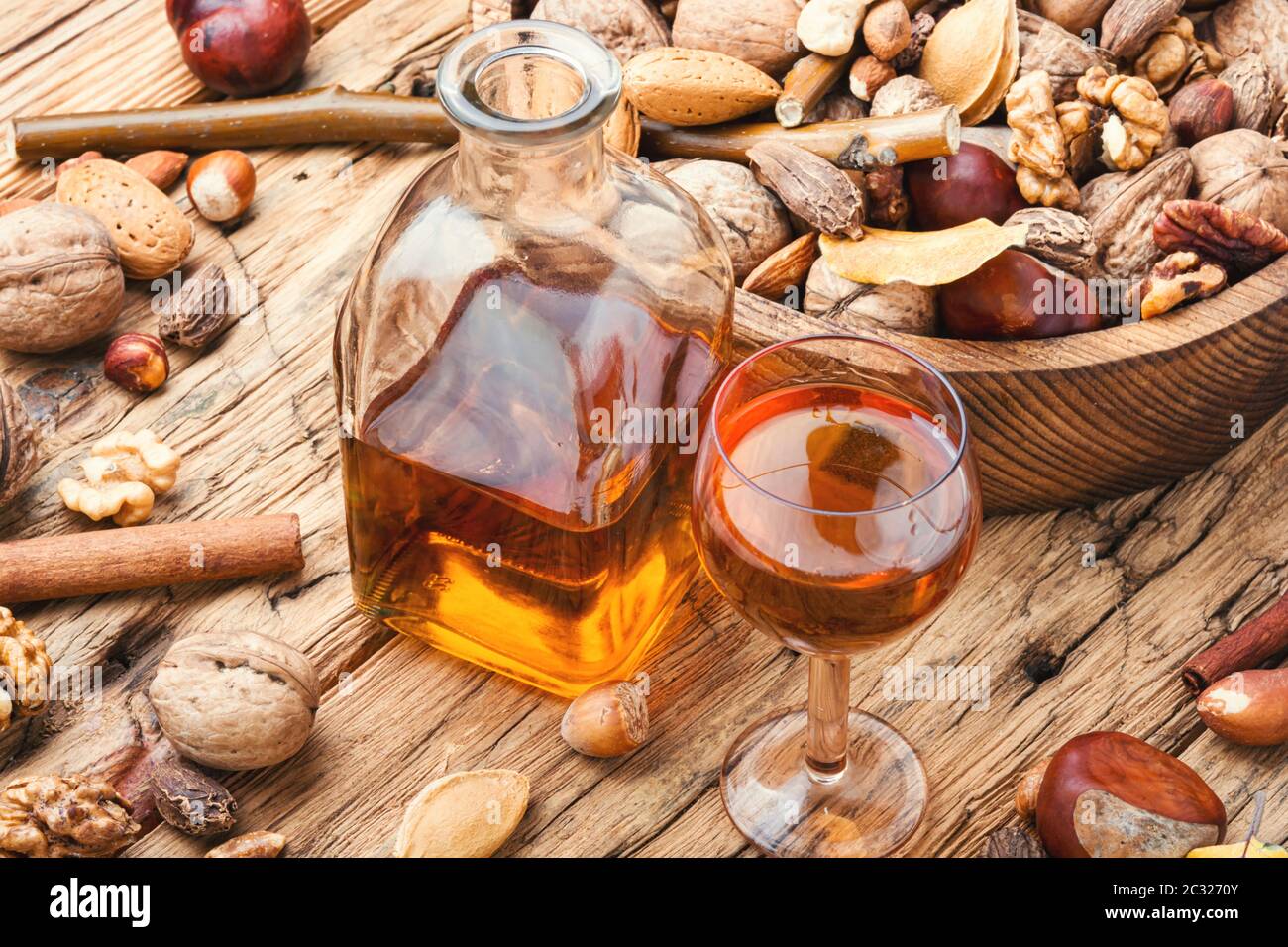 Shot glass with aromatic alcohol from nuts.Nut liquor.Tincture on nuts ...