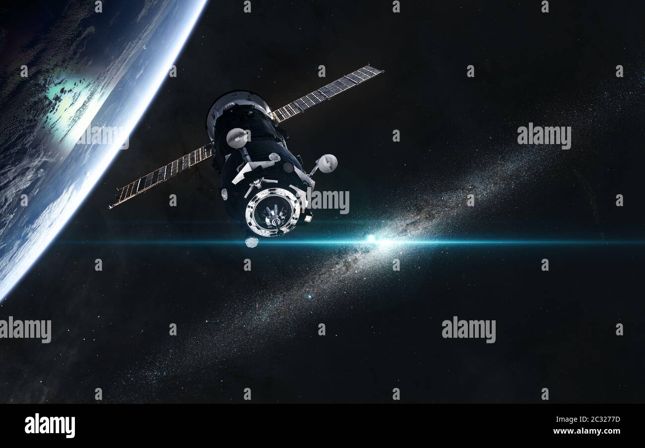 Space station in orbit of the planet. Galaxy disc somewhere in deep ...