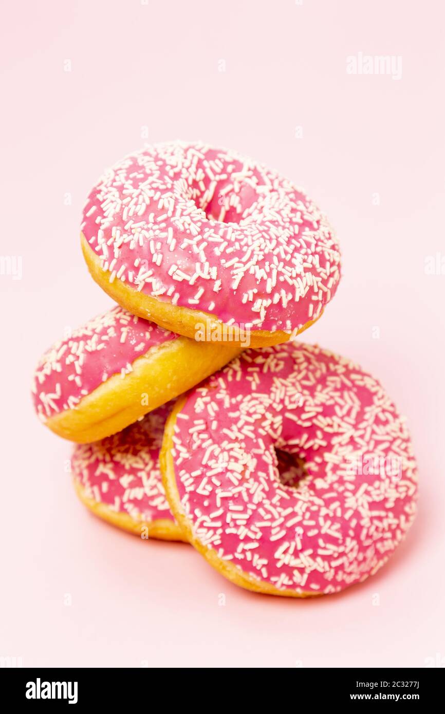 Pink iced donut hi-res stock photography and images - Alamy