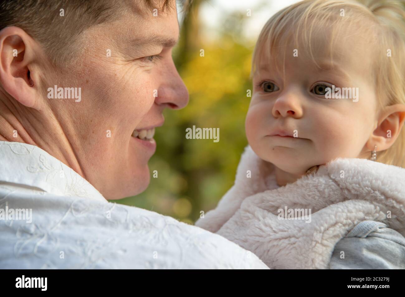 Dad and daughter enjoying autumn in a castle park at beautiful weather ...
