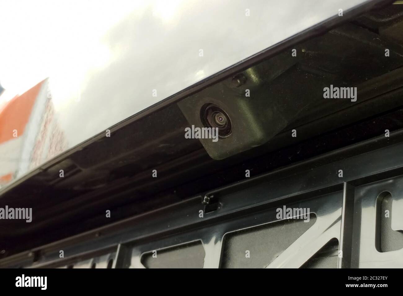 Black rear view camera with washer on a car. Close up Stock Photo - Alamy